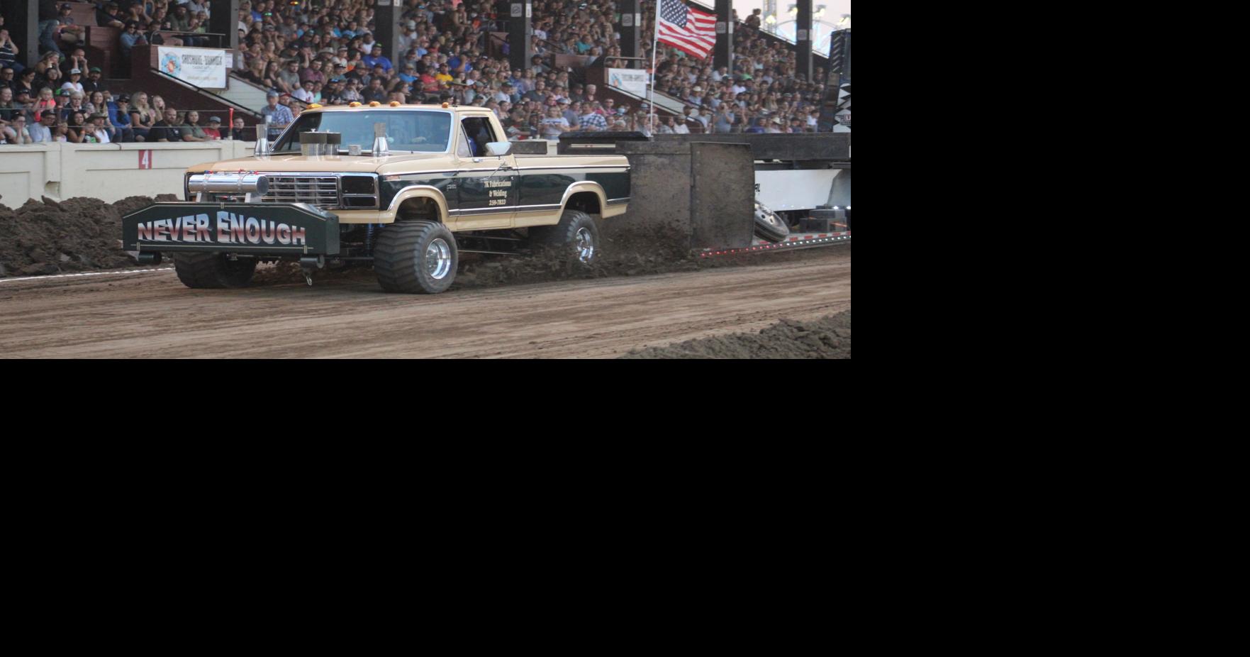 people pulling trucks