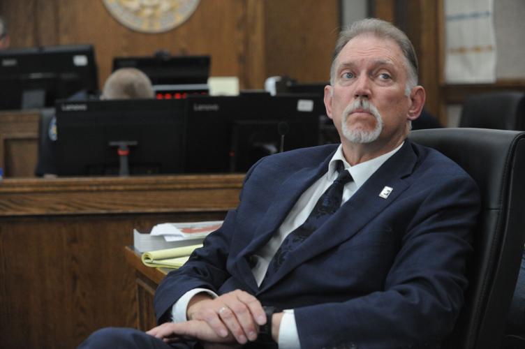 On third day of murder trial, defendant's wife testifies she initially ...