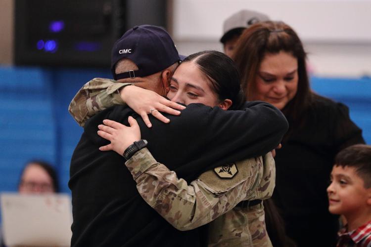 Returning military member surprises her children at school assembly ...