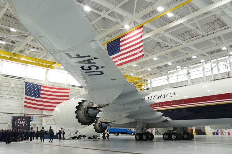 President Donald Trump unveils the new Air Force One, a converted ...