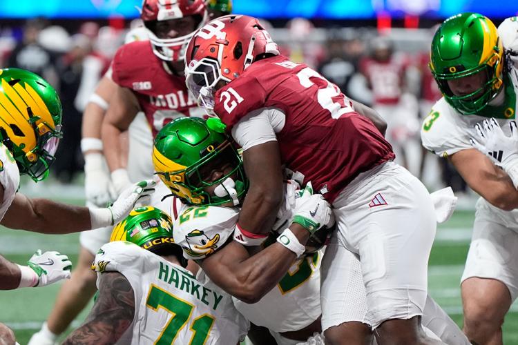 Dante Moore and the Oregon Ducks self-destruct in 56-22 Peach Bowl loss ...
