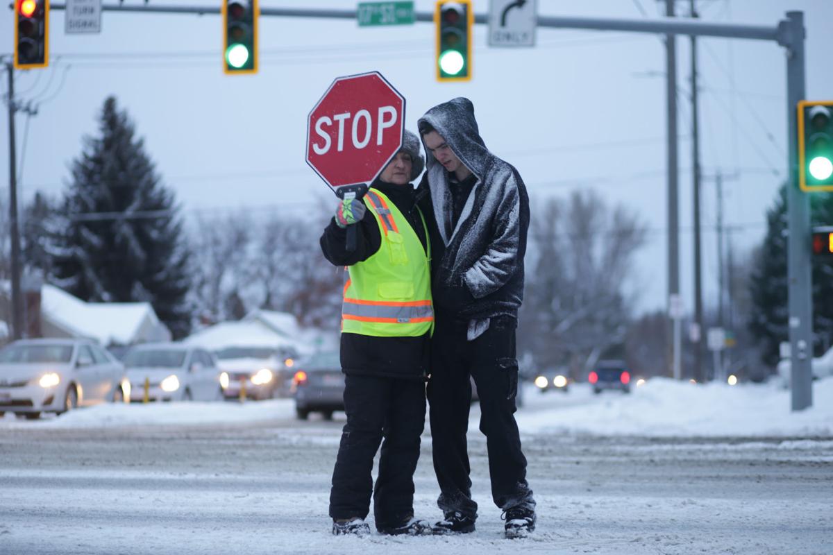 Crossing guards help kids navigate the icy roads | Education ...
