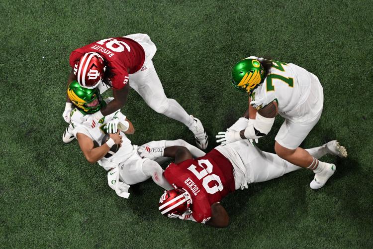 Dante Moore and the Oregon Ducks self-destruct in 56-22 Peach Bowl loss ...