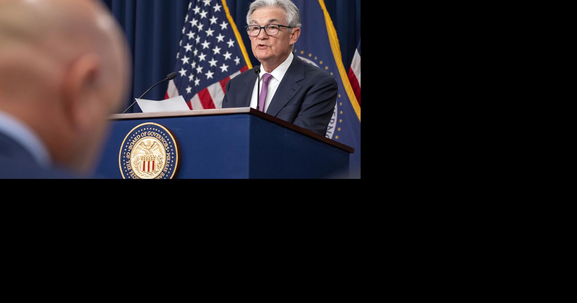 Fed keeps rates unchanged for first time in 15 months but signals 2 ...