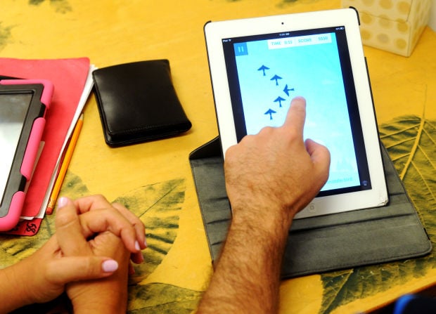 iPad apps aid in stroke victim's recovery