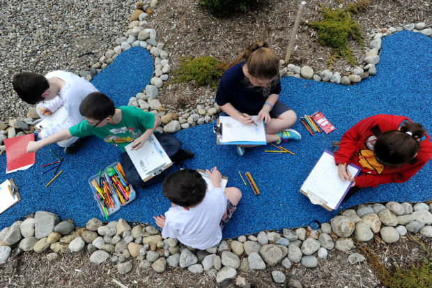 Dirty hands, keen minds: Students build garden, learn about ...