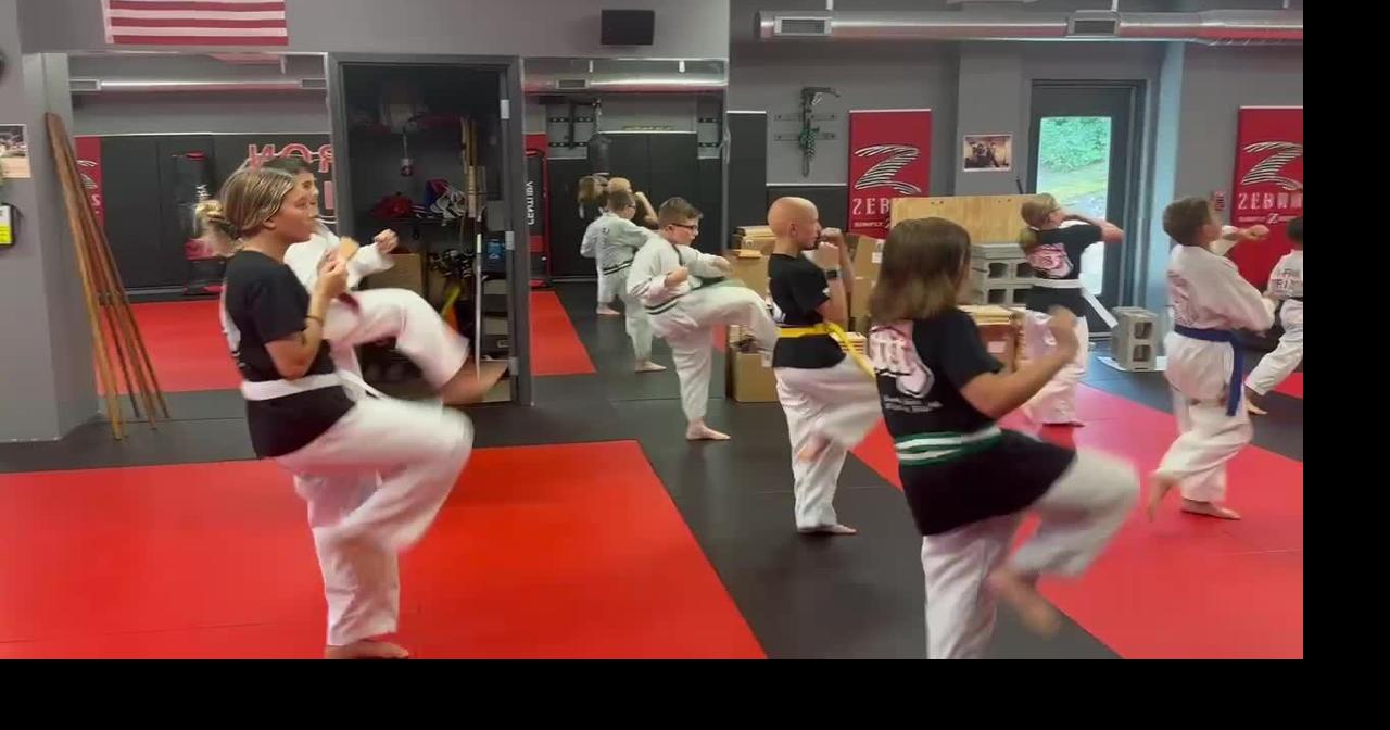 Iron Fist students practice kicks