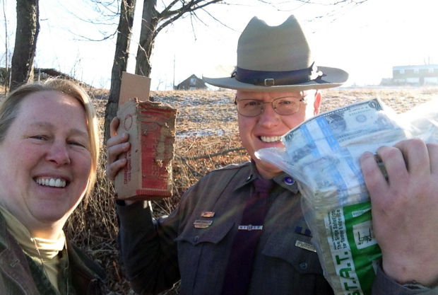 Greenwich woman sees money fall from armored car, calls police
