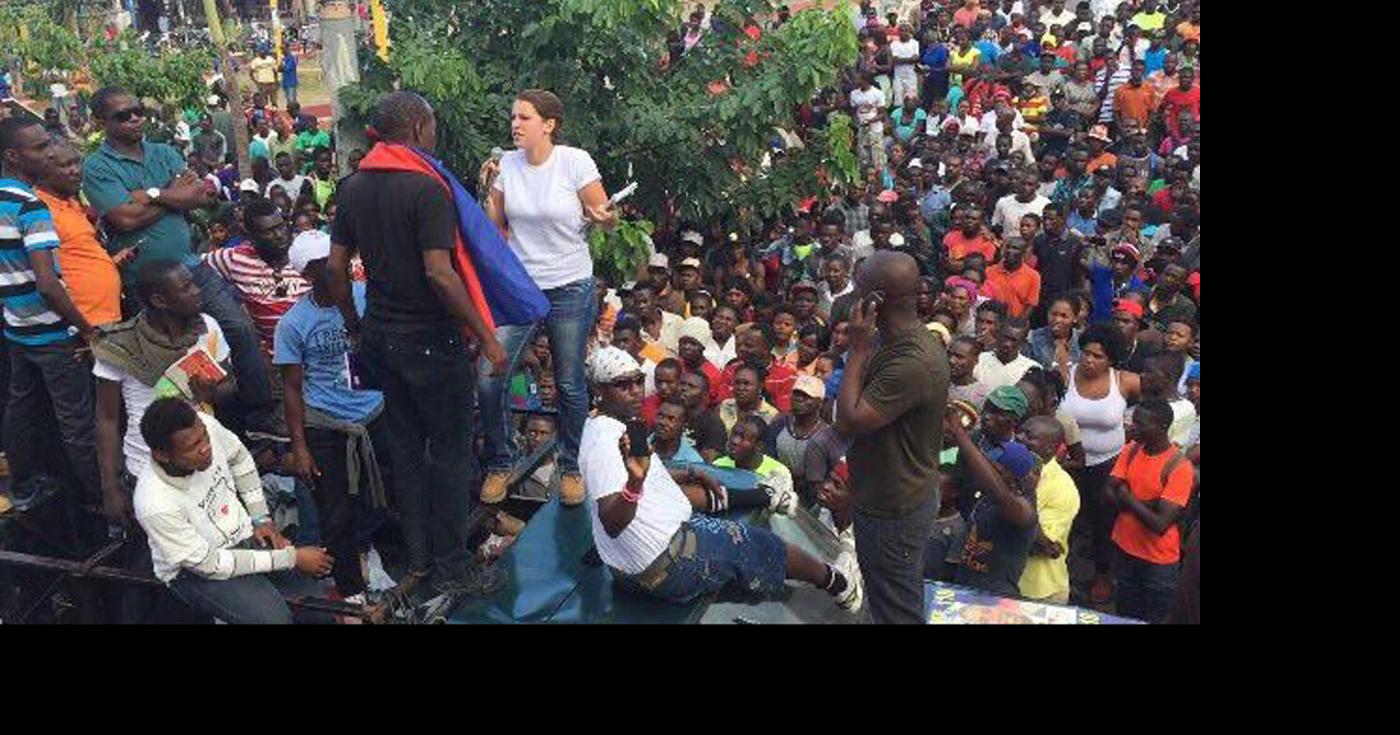 Local woman faces protest leaders amid recent Haitian riots