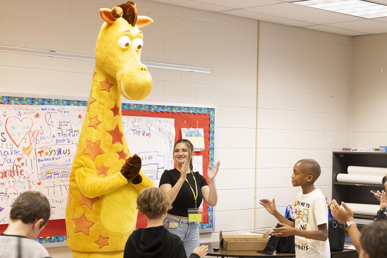 Geoffrey the Giraffe visits fifth graders at Hamilton school