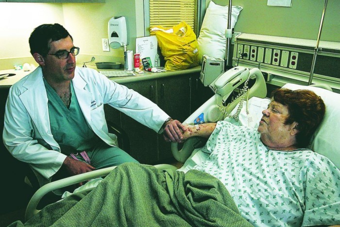 Doctors' bedside manner should involve some sitting