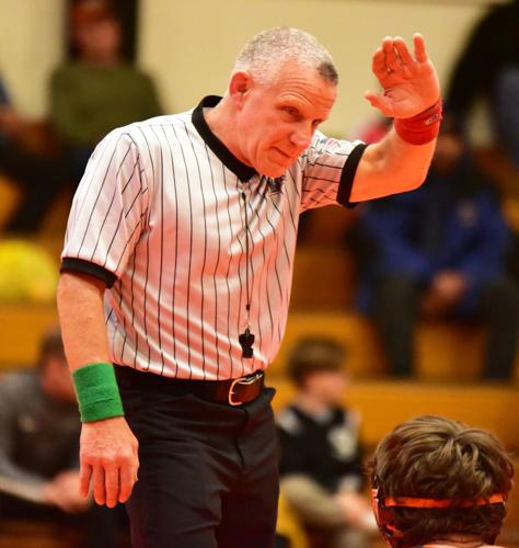 Former EHT wrestling coach now on the other side of the mat as referee