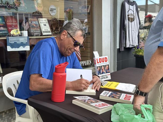 Angelo Cataldi signs copies of books in Ocean City