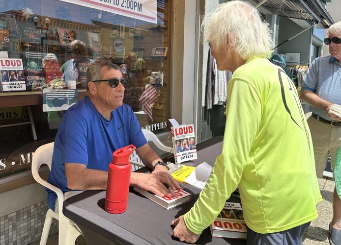 Angelo Cataldi signs copies of books in Ocean City