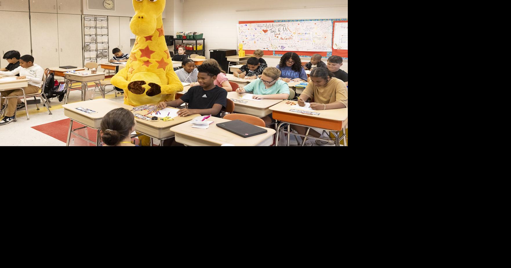 Geoffrey the Giraffe visits fifth graders at Hamilton school