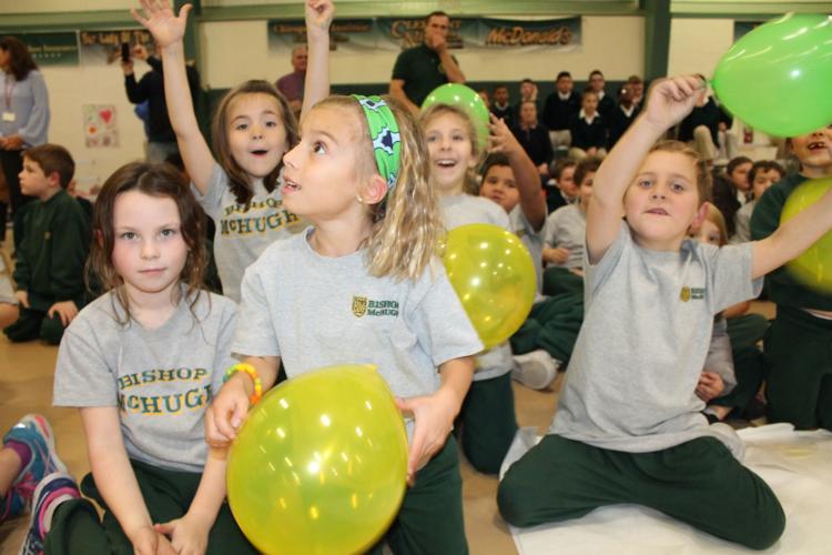Bishop McHugh dedicates gym floor to former athletic director Lori Larkin
