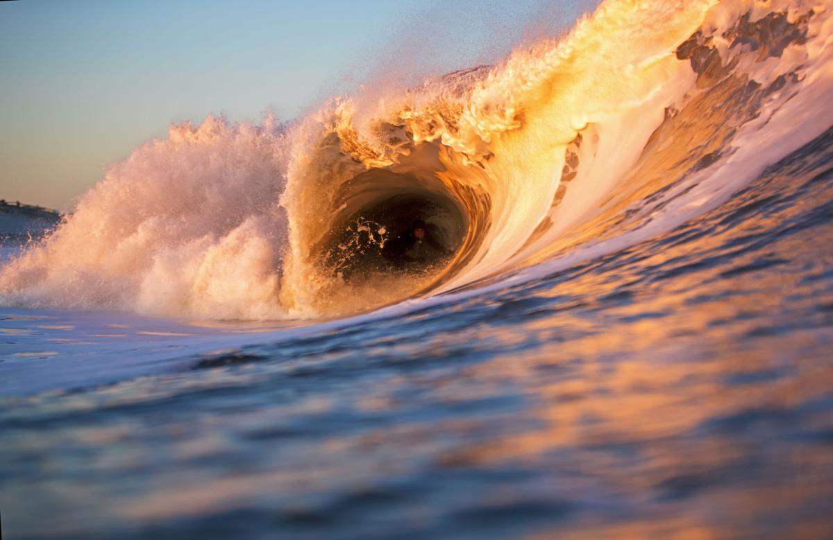 Pro surfer Rob Kelly surfs ferry wake in Cape May