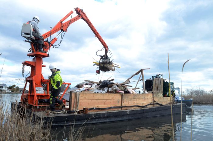 Contractors cleaning up hurricane debris in New Jersey coastal waters