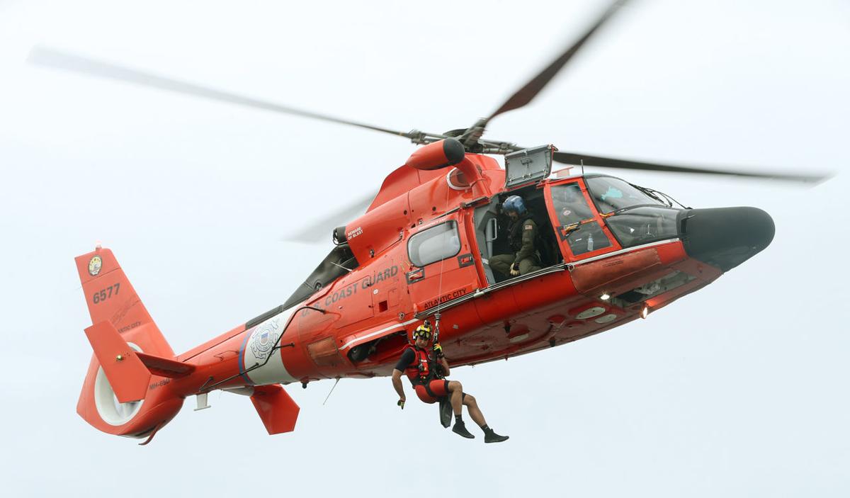 U.S. Coast Guard rescue swimmers act as paramedics in the water ...