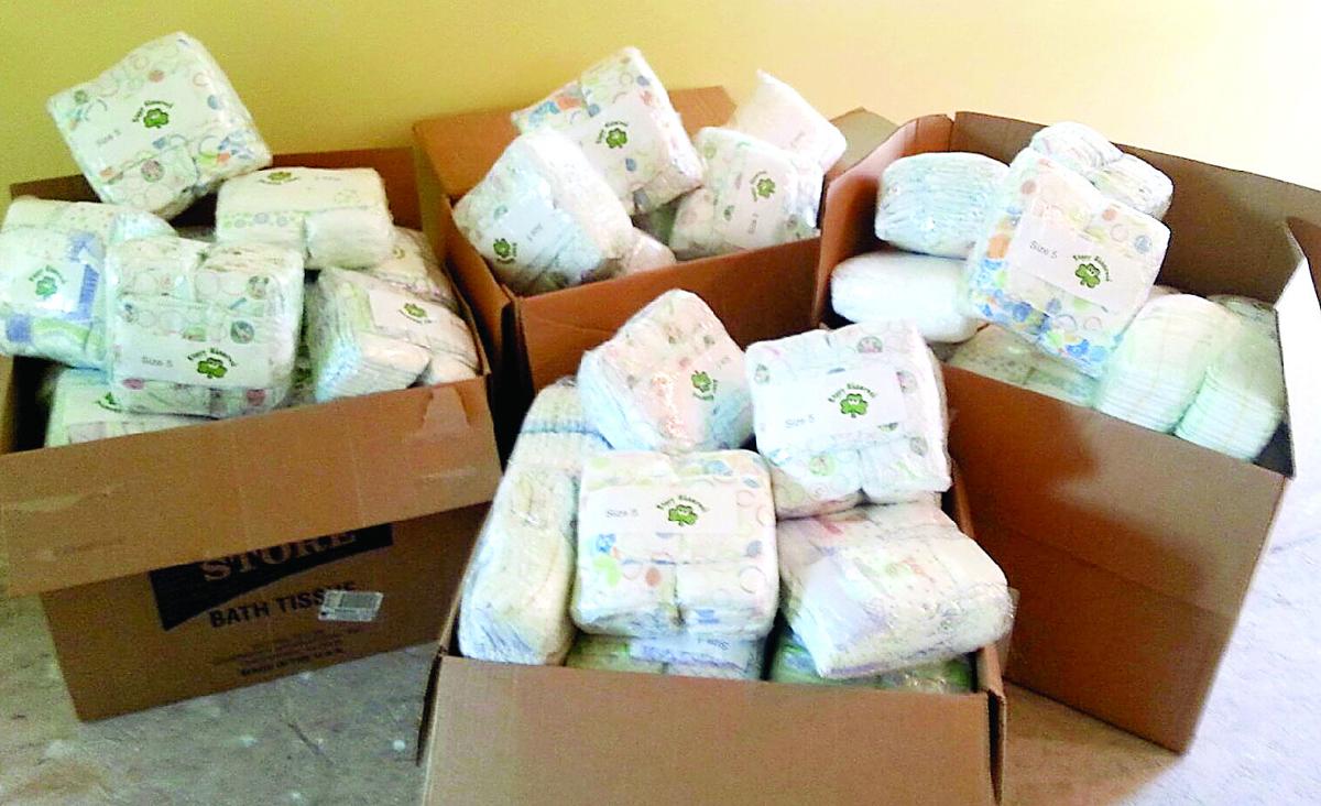 Ancient Order of Hibernians donates 2,500 diapers to Caring for Kids