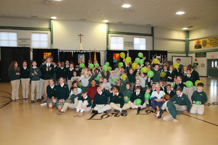 Bishop McHugh dedicates gym floor to former athletic director Lori Larkin