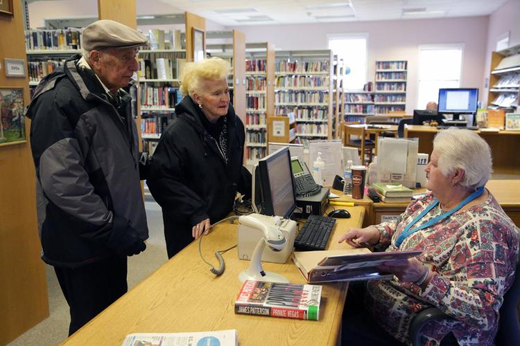 After a storm, some seek shelter in library stacks