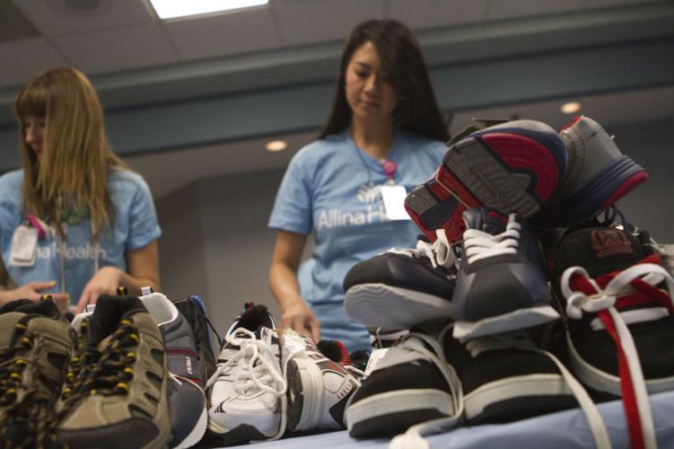 Local kids get fitted with new shoes at Cambridge Medical Center | News ...