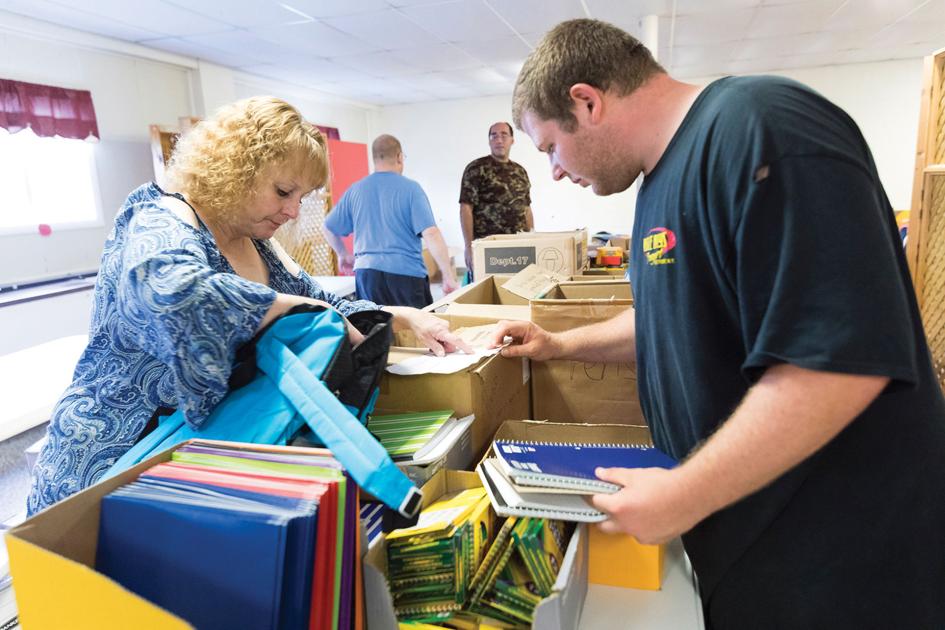 Volunteers fill backpacks with school supplies | News | pressrepublican.com