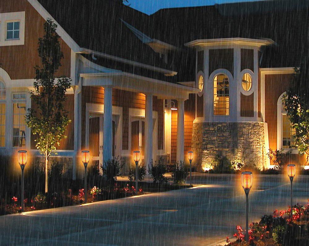 People are loving these flameless solar torch lights | Home-and-garden ...