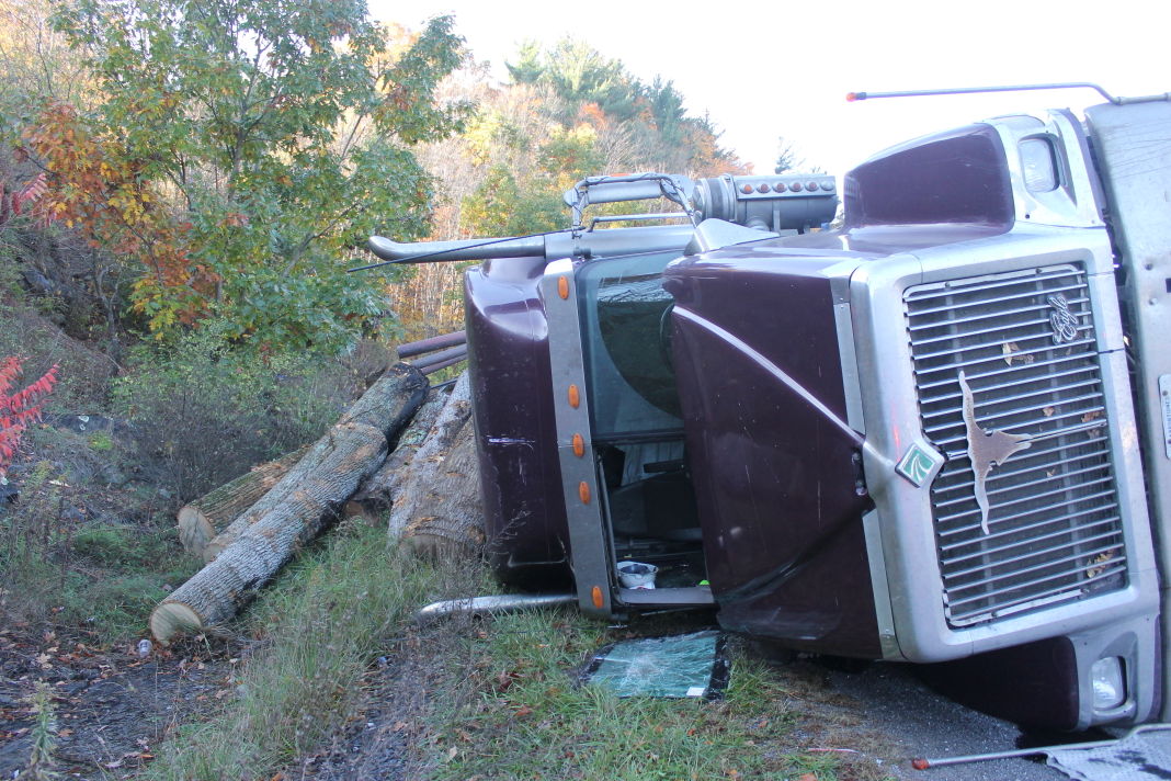 Log truck flips near Princeton | News | ptonline.net