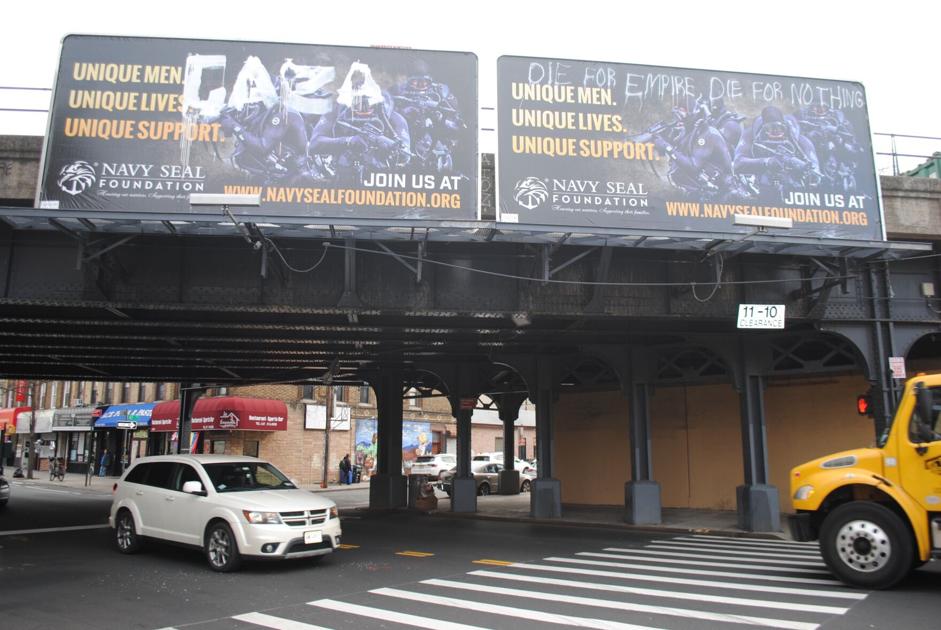 Graffiti defaces Navy SEAL ads | | qchron.com