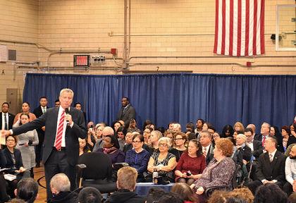 Mayor defends his positions at crowded town hall | | qchron.com