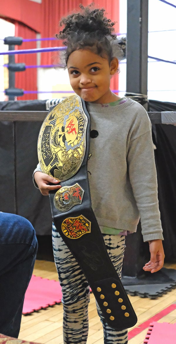 Wrestlers work to body slam cancer | | qchron.com