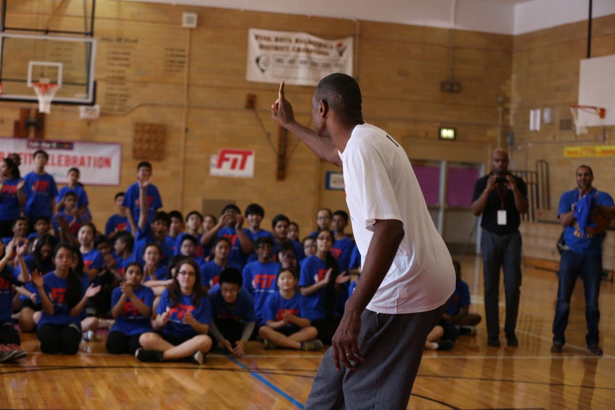 NBA legend helps christen JHS 216's new hoops court | | qchron.com