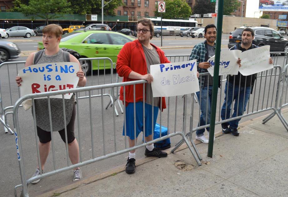 Housing advocates protest | | qchron.com