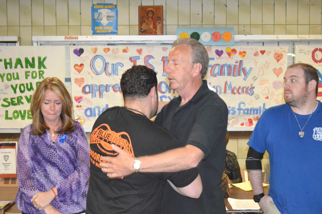 A slain cop’s two families | | qchron.com