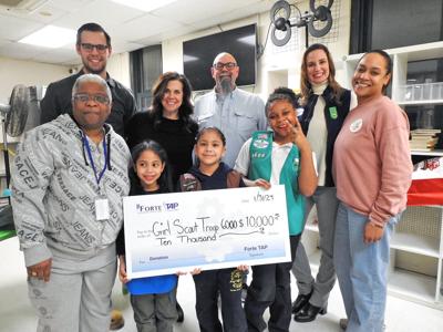 Girl Scout Troop 6000 receives $10K | | qchron.com