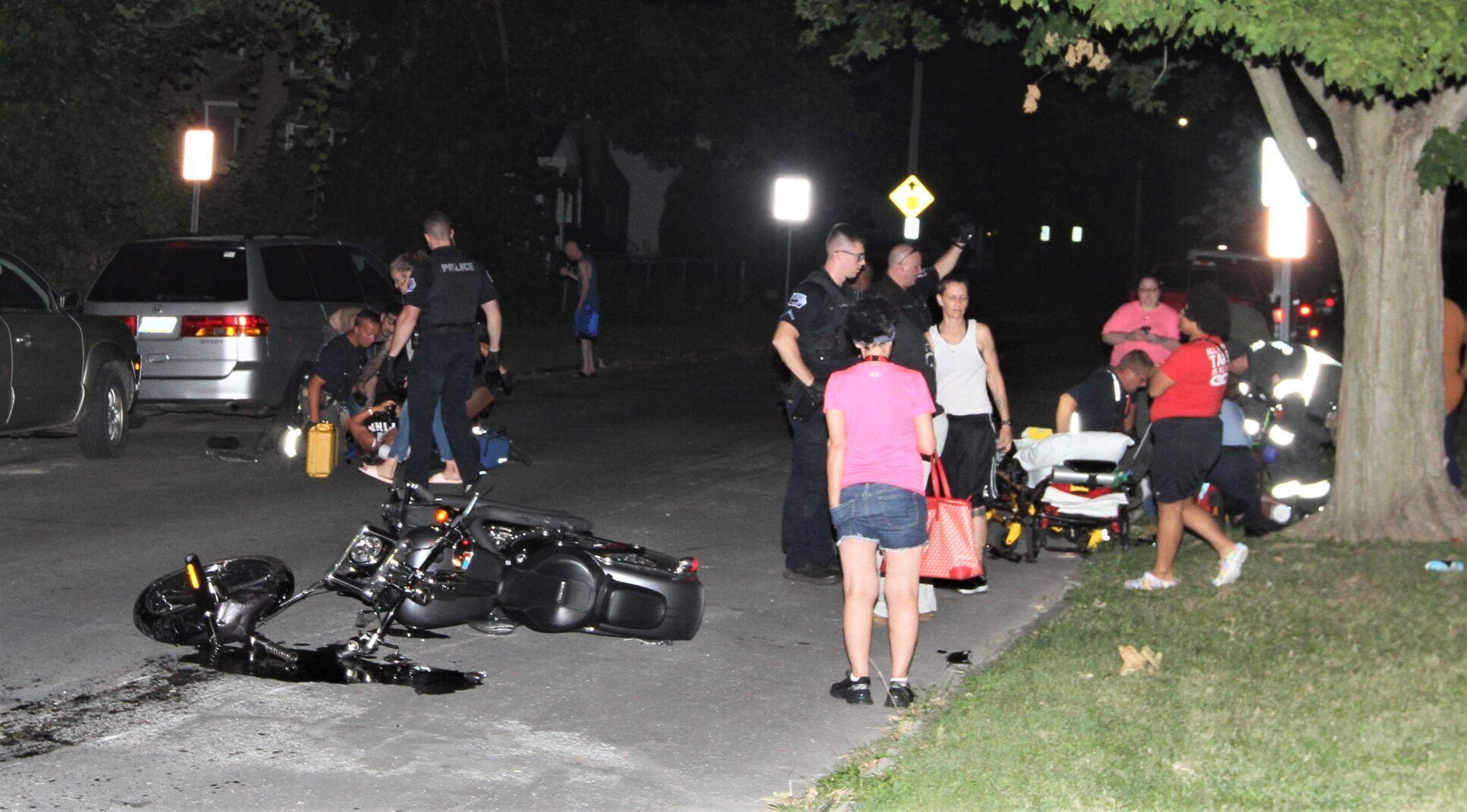 Two injured when their motorcycle strikes car