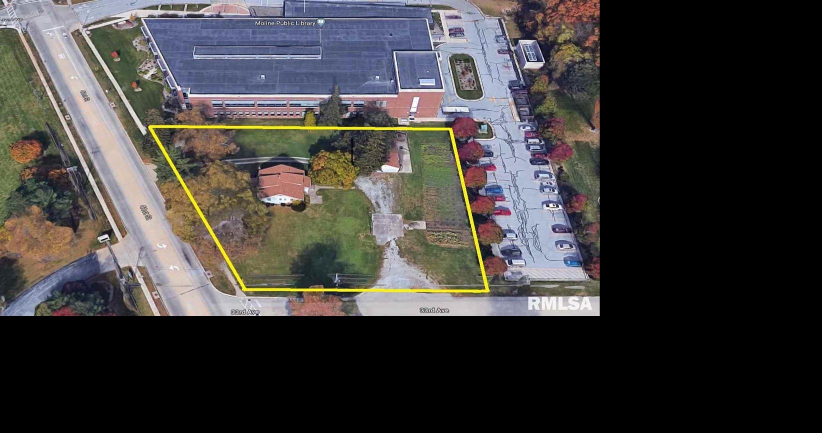 Moline buys property behind public library