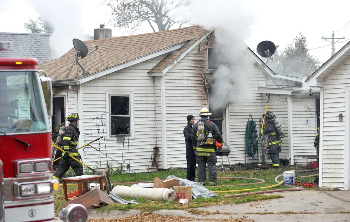 Rock Island firefighters rescue one person, a dog from Tuesday house fire