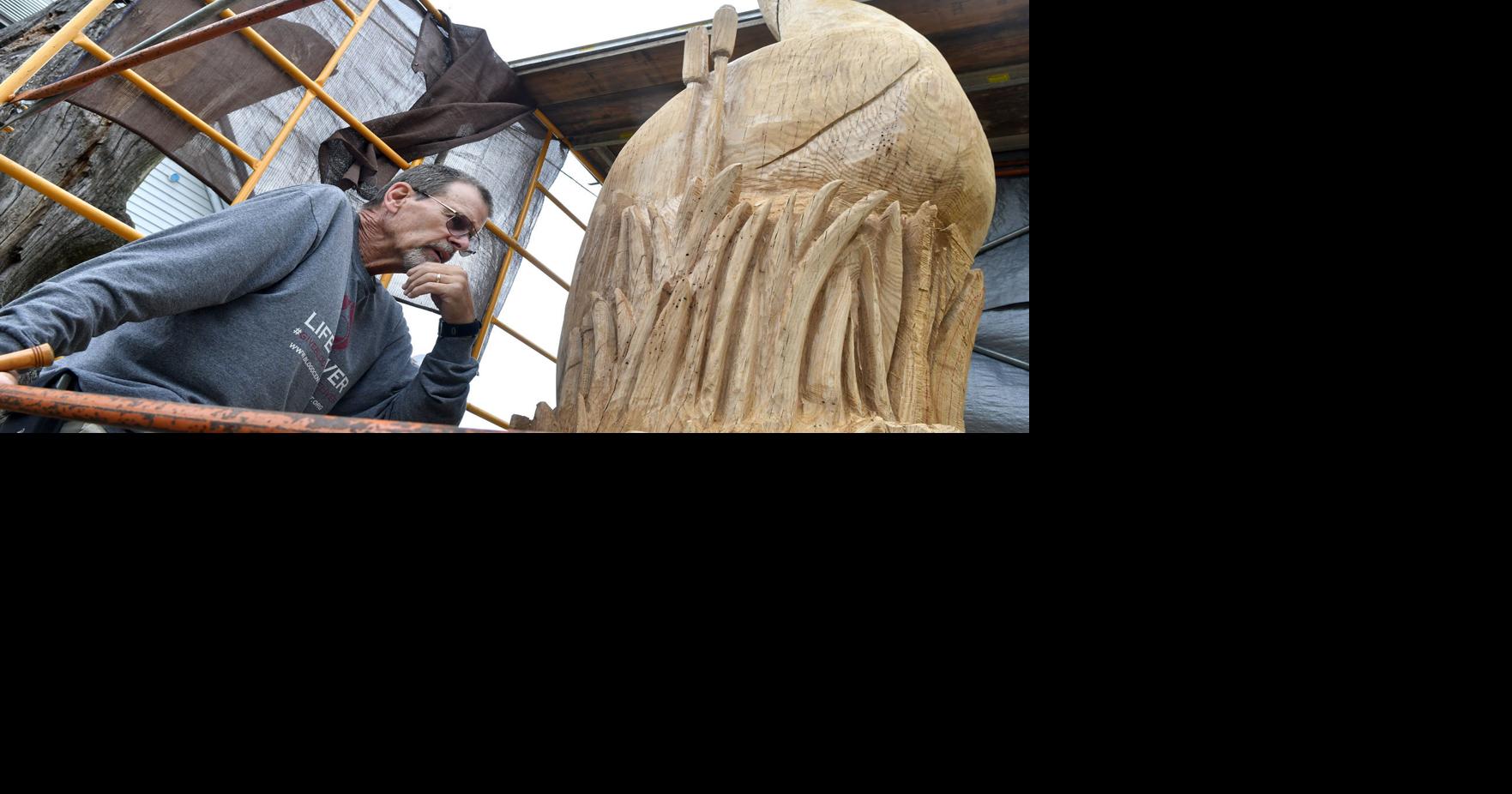 Davenport tree-carver chisels a new crane