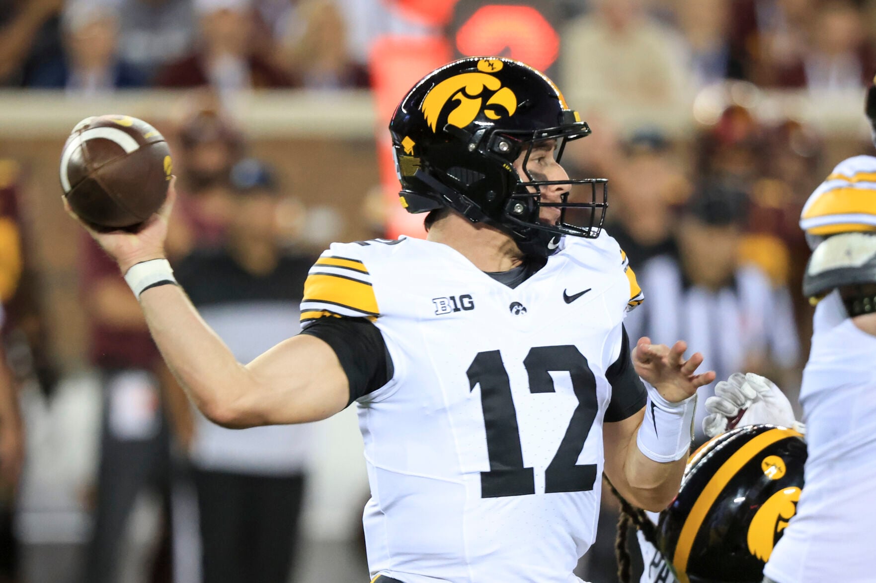 Iowa QB explains unique tendency to throw without laces