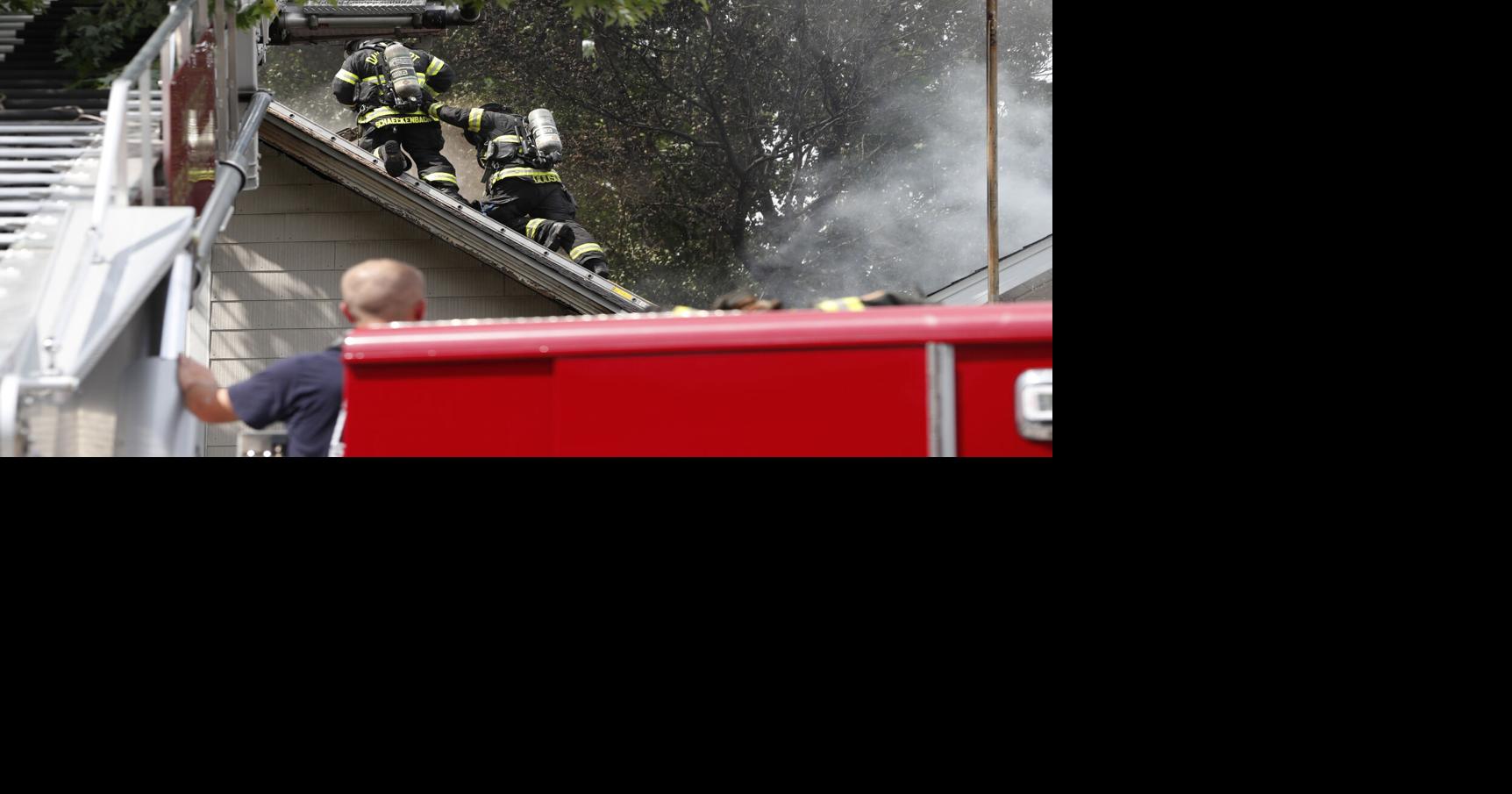 Firefighters battle double house fire Wednesday in Davenport