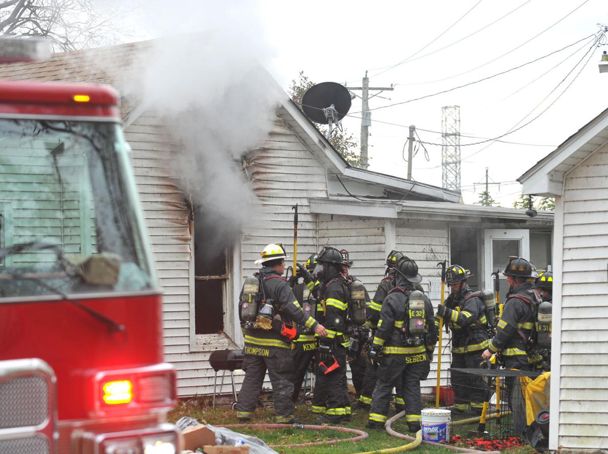 Rock Island firefighters rescue one person, a dog from Tuesday house fire