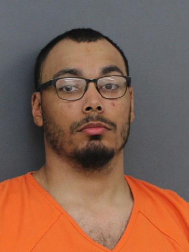 Three charged in robbery of armored truck employee