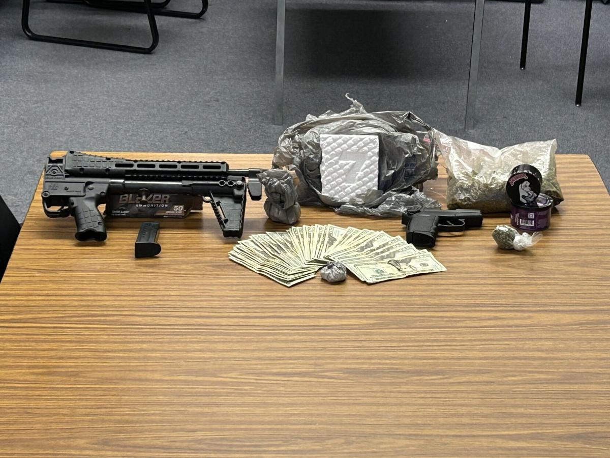 MEG agents arrest man with a pound of cocaine, two firearms