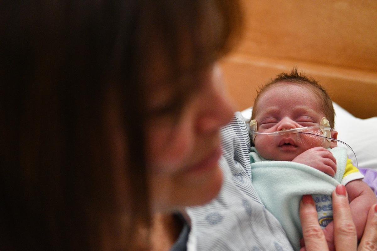 'It's a rewarding job to have': Baby cuddling program benefits ...
