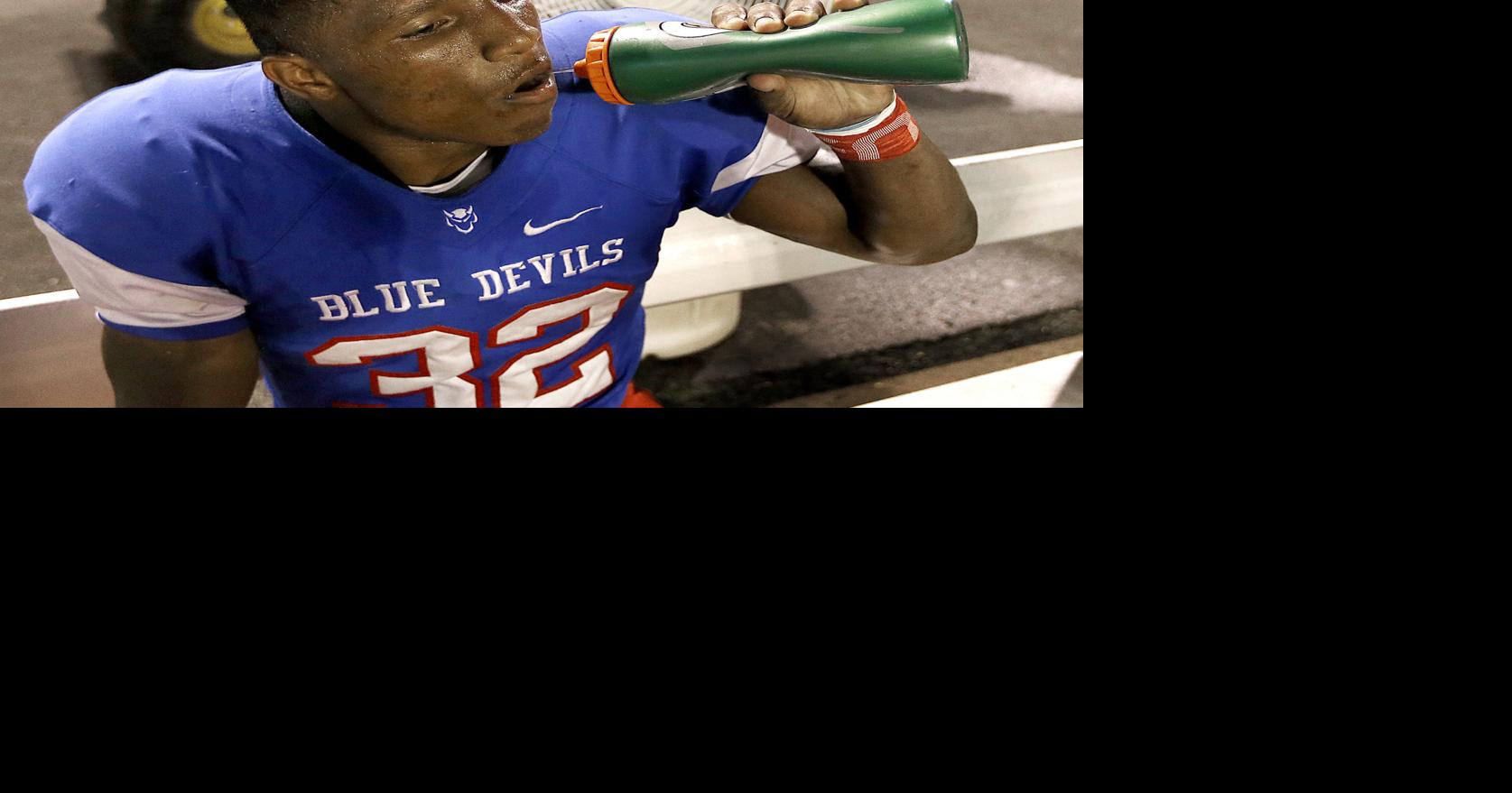 Photos: Davenport Central's Jatoviay Hill rushes for 406, a new MAC record.