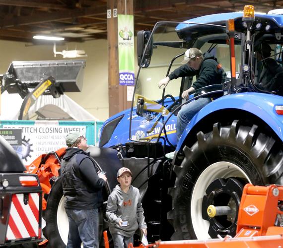 Farmers talk grain prices, trade at annual farm show at QCCA Expo Center