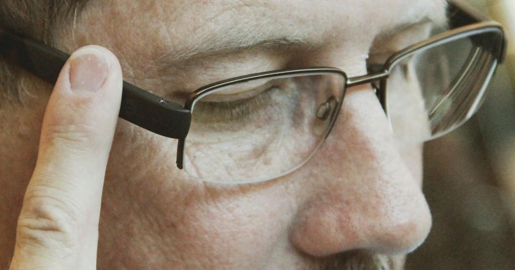 High-tech eyeglasses focus instantly at touch of a finger